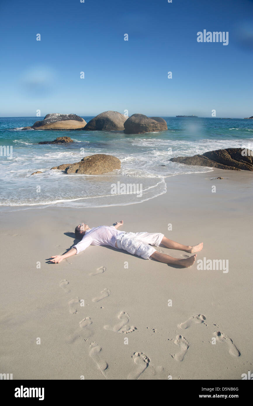 Man Lying on Beach Stock Photo - Alamy