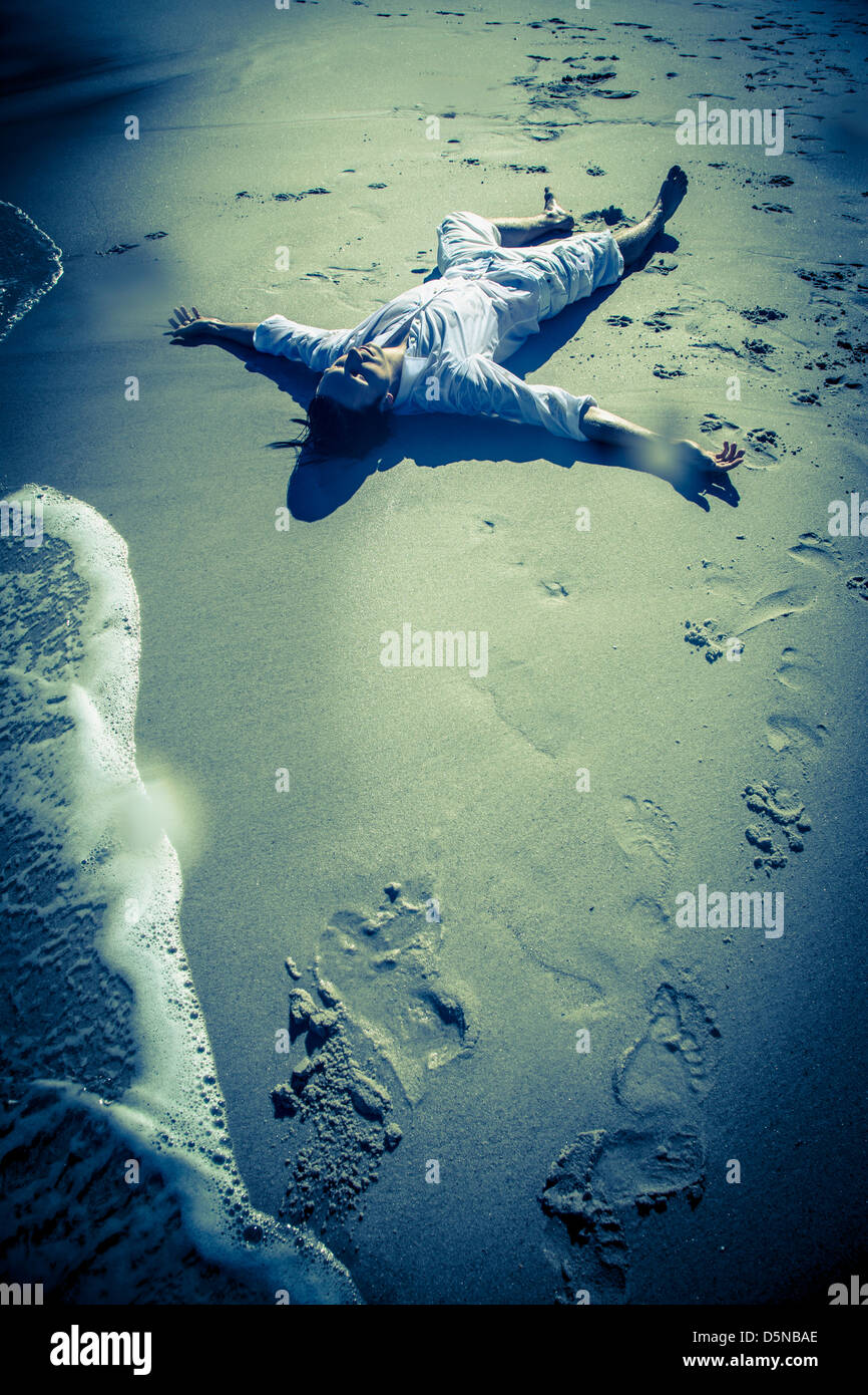Man Lying on Beach Stock Photo - Alamy