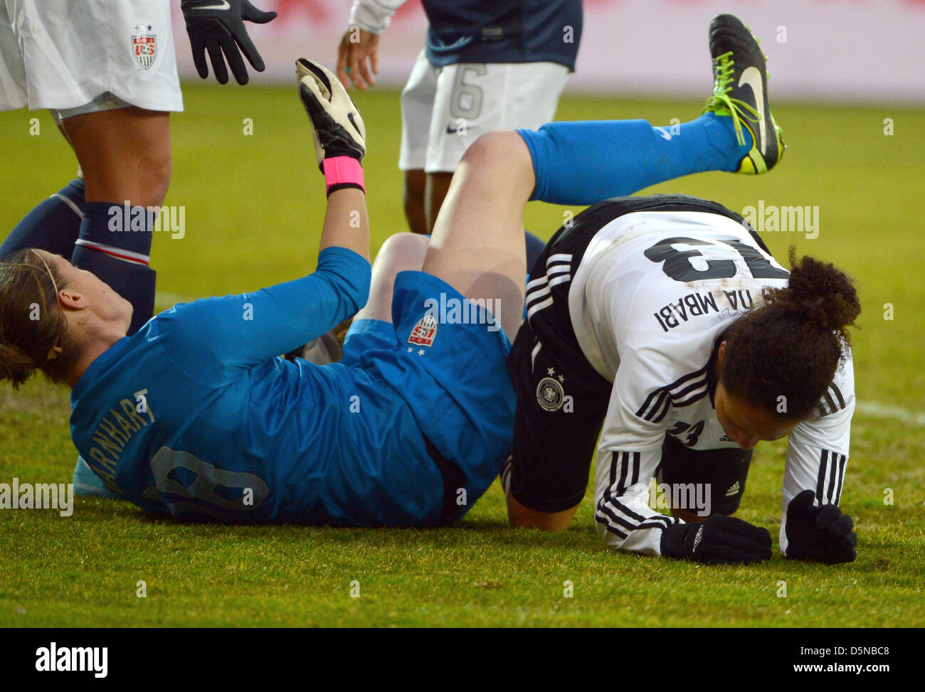 Germany's Celia Okoyino Da Mbabi (R) lies on the ground after a missed ...
