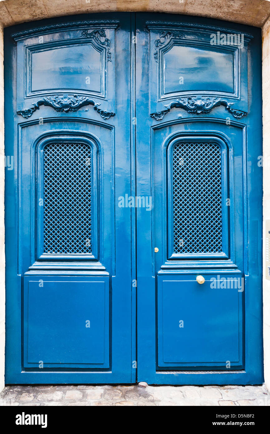 French blue wooden door in Paris, Italy Stock Photo - Alamy