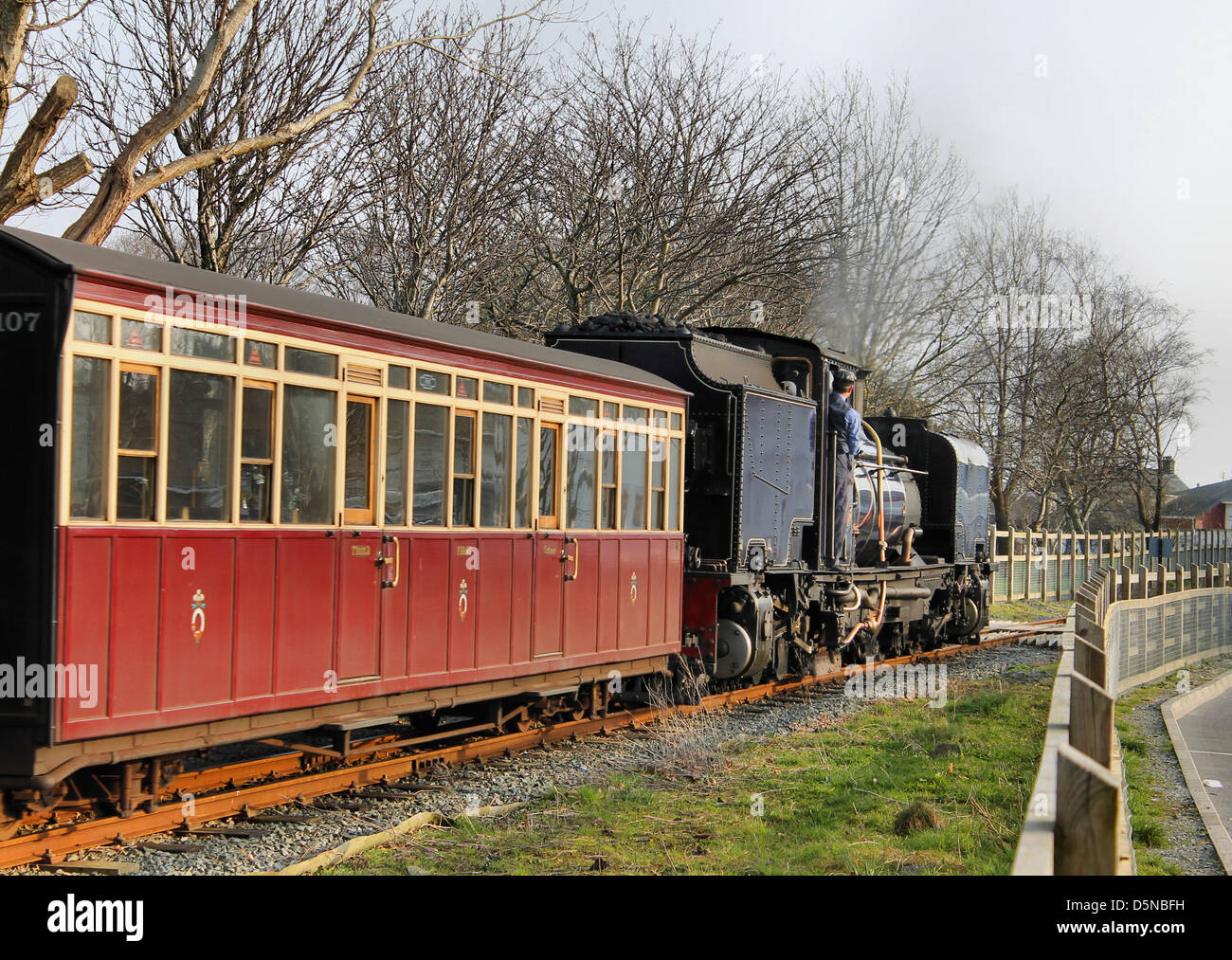 Steam engine train coming into Porthmadog from Caernarfon Stock Photo ...