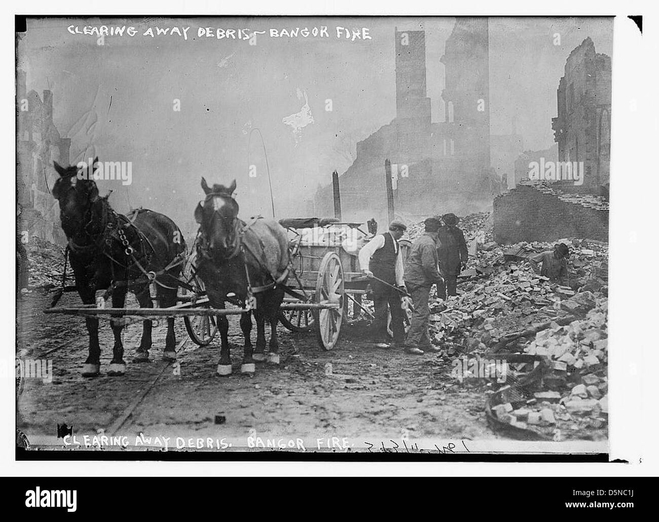 A scene of men clearing away debris following the Great Fire of Bangor ...