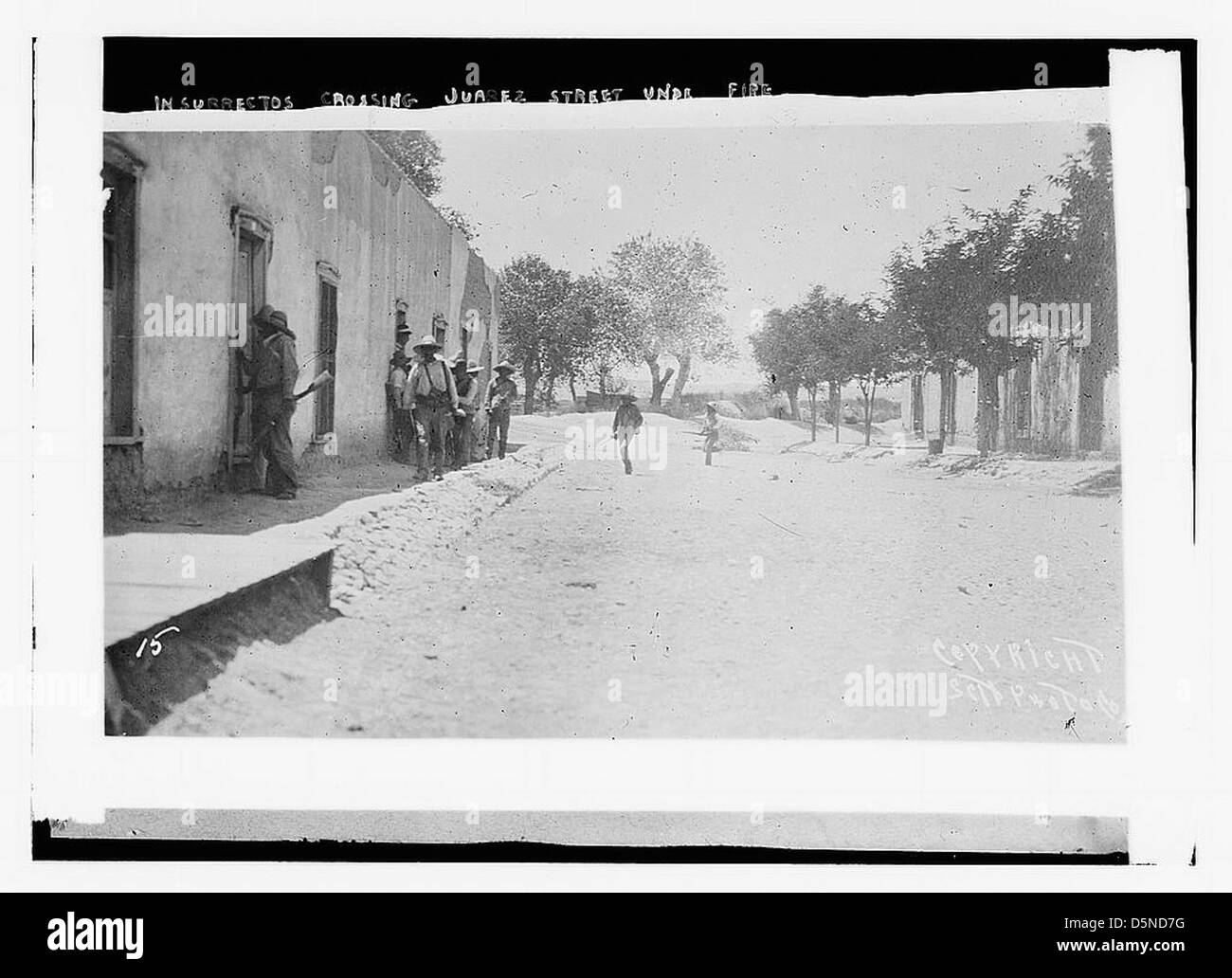 This photograph shows insurgents, known as Insurrectos, crossing Juarez ...