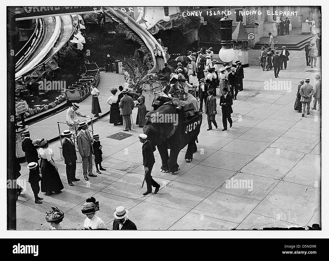 A photograph from Coney Island, New York, in the 1910s, showing people ...