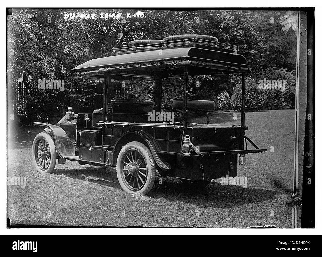 A photograph of a Dupont camping auto from the 1910s, featuring a ...