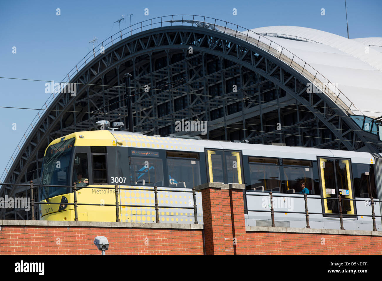 Yellow Metrolink tram in Manchester city centre Northern England UK ...