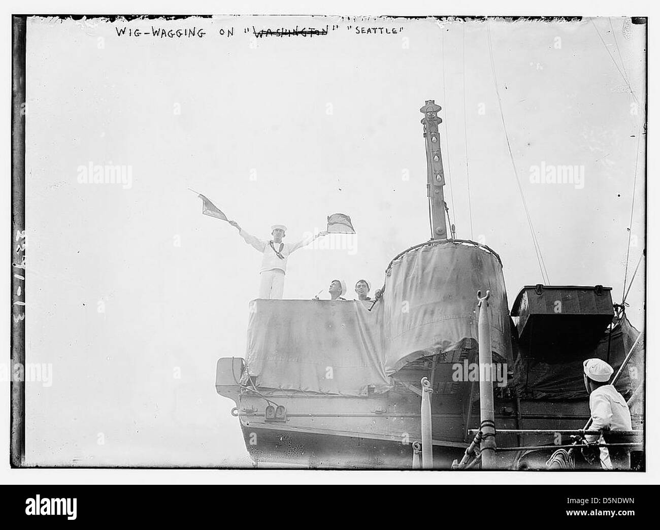 This image shows sailors aboard the USS Seattle (CA-11), an armored ...