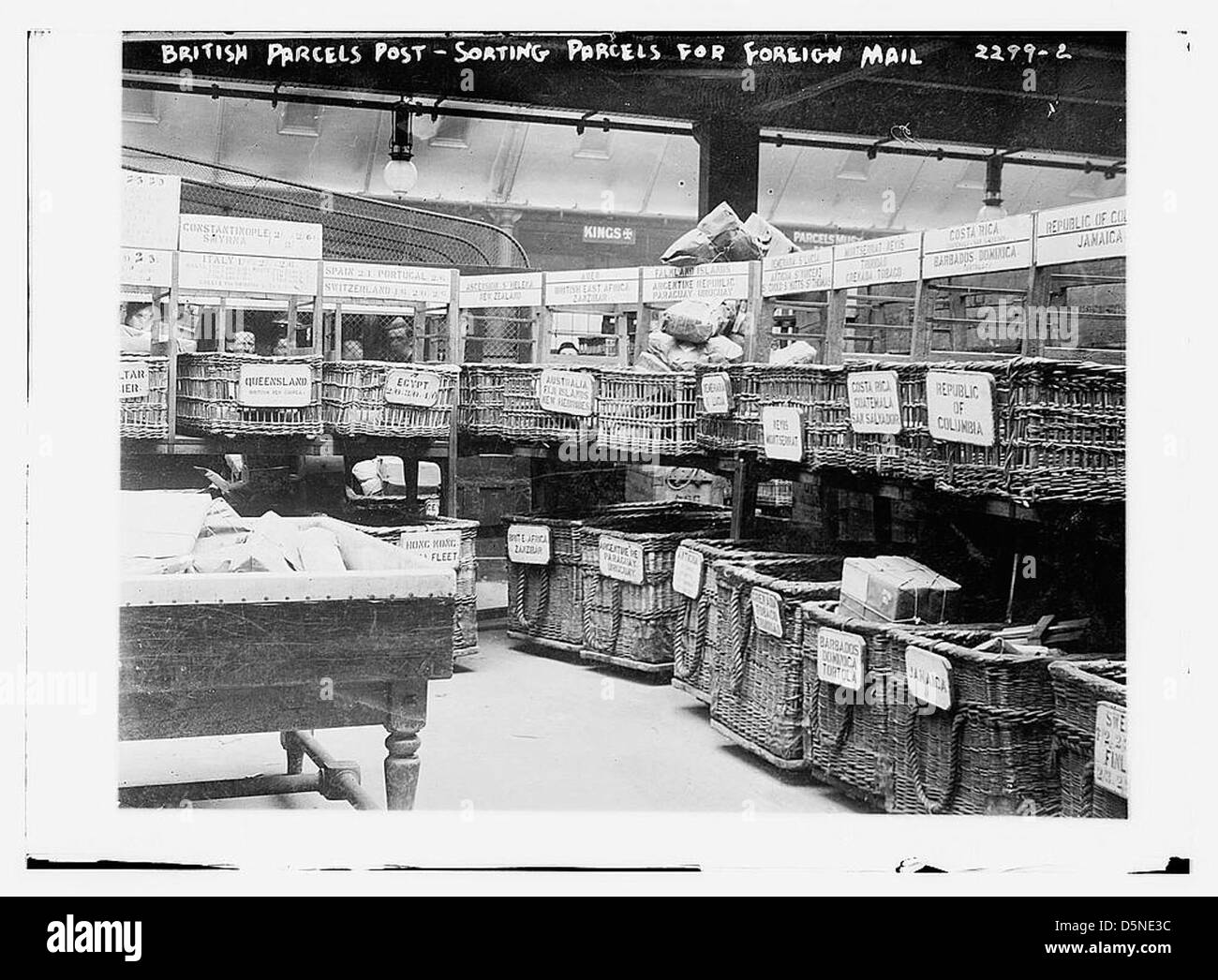 This photo shows British postal workers sorting parcels for foreign ...