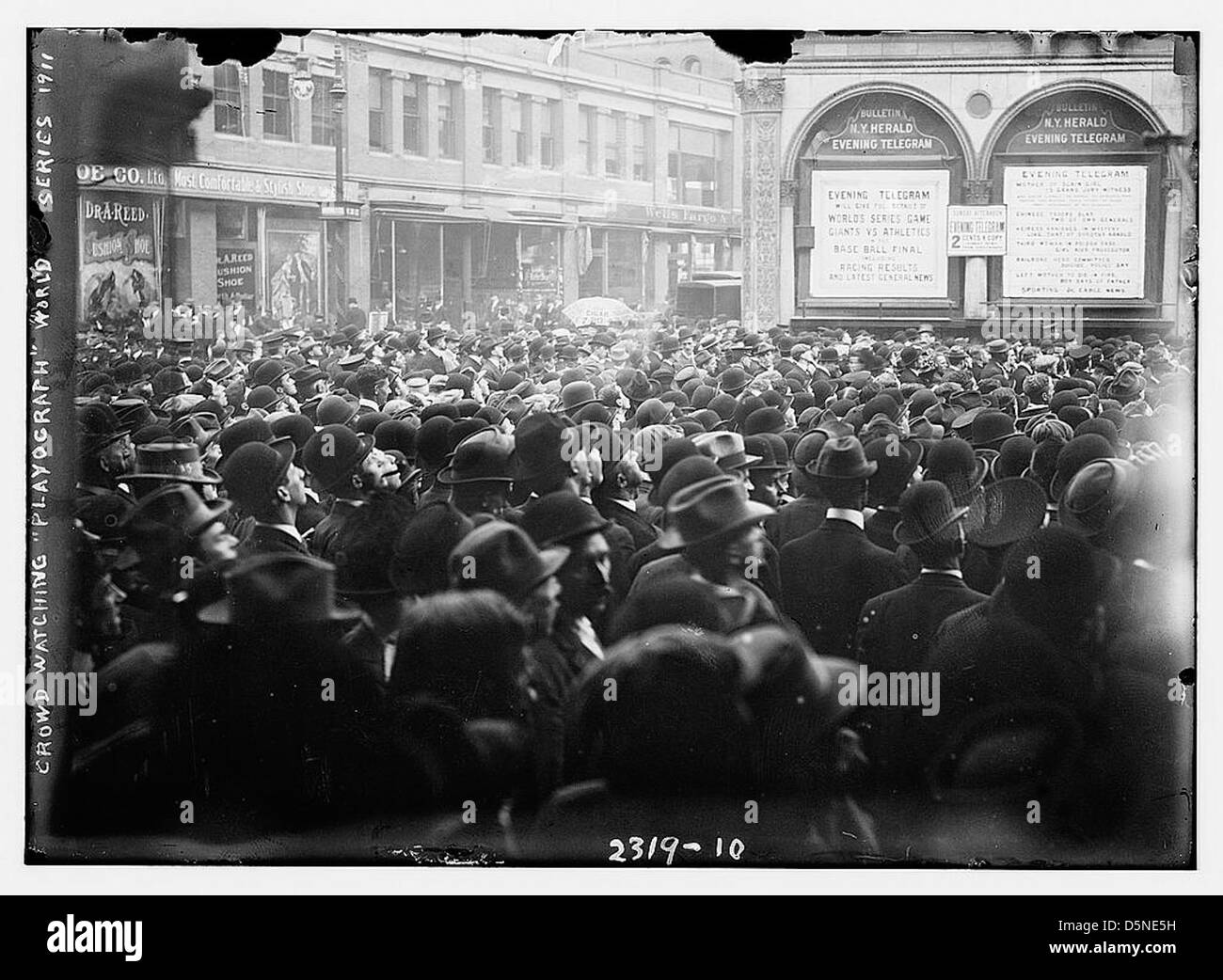 This photograph shows a crowd gathered to watch the 'playograph' during ...
