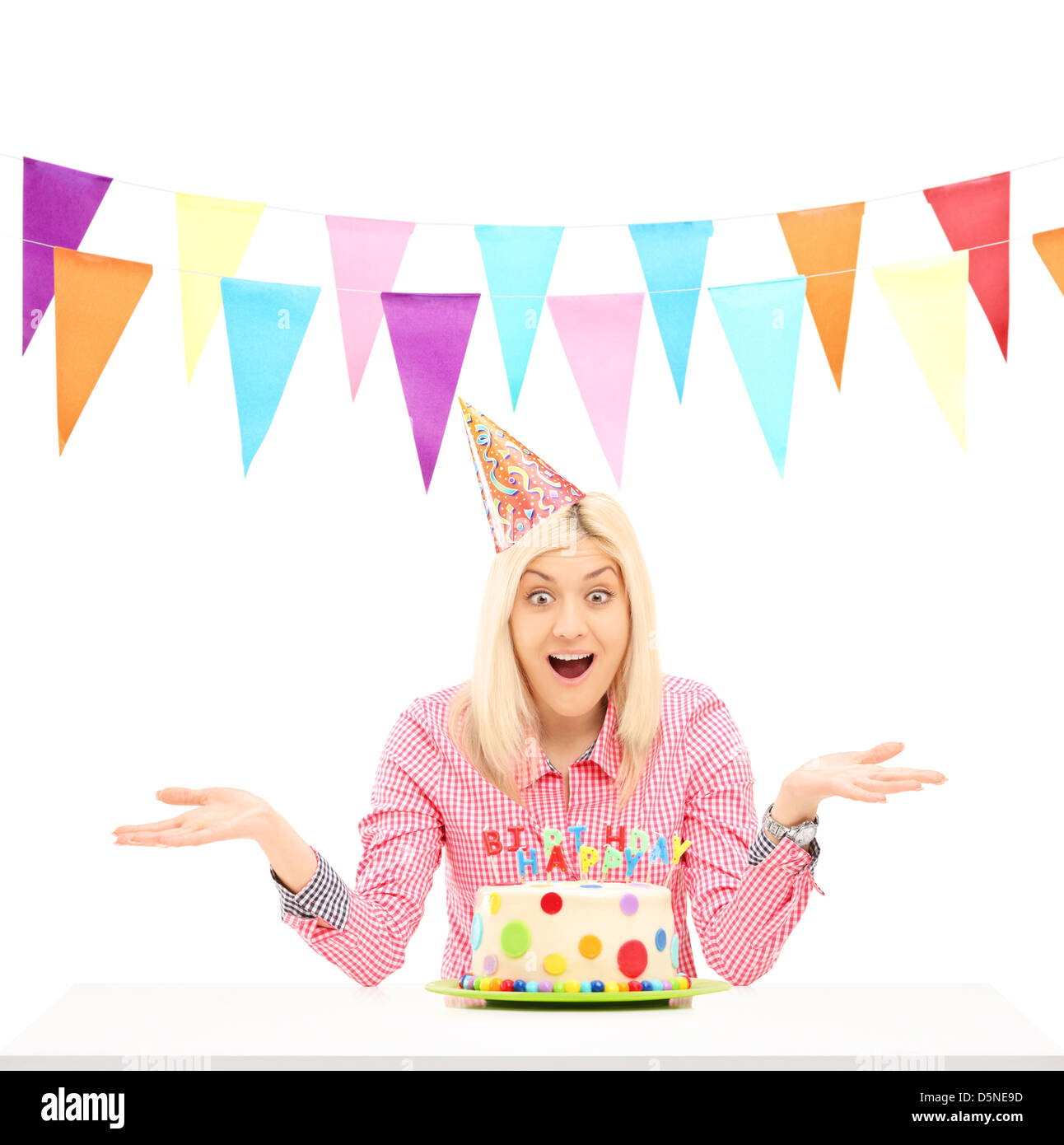 Smiling birthday female wearing party hat and gesturing isolated ...