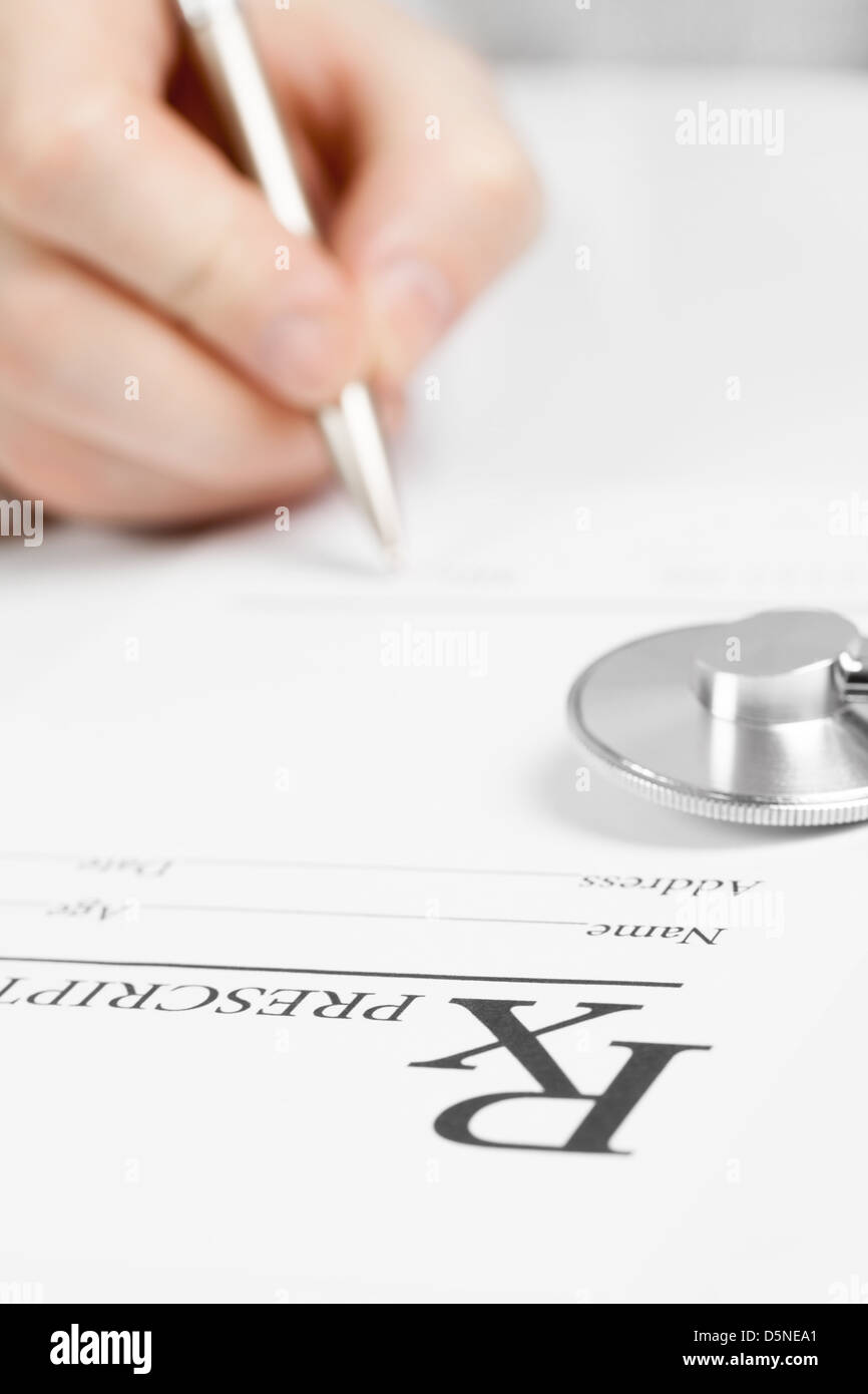 Medical doctor signing prescription - ideas for healthcare Stock Photo ...