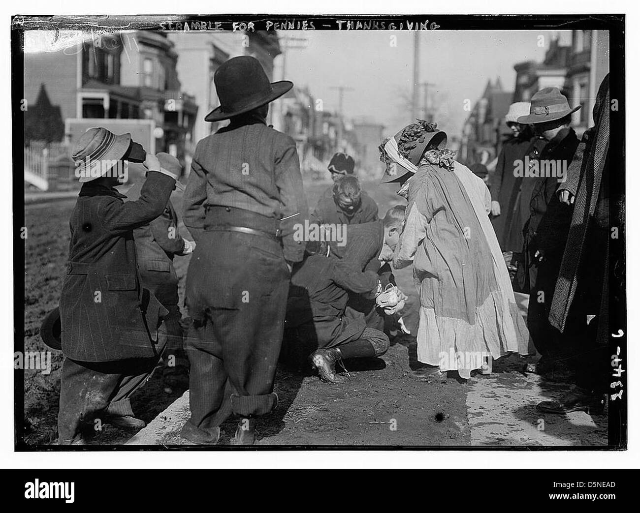 This image from the 1910s shows children in costumes scrambling for ...