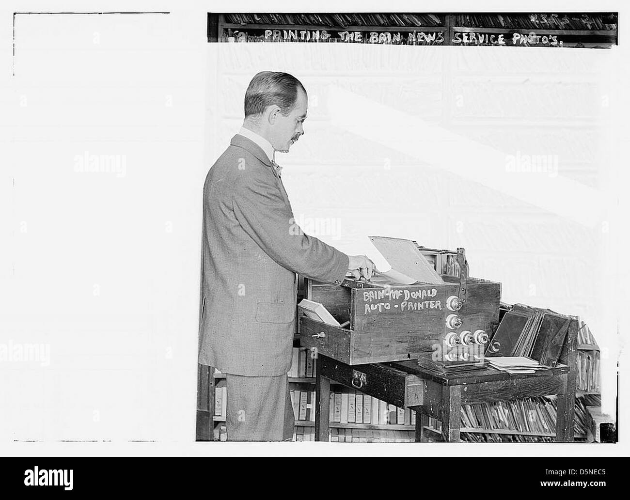 A photograph showing the printing process of Bain News Service photos ...