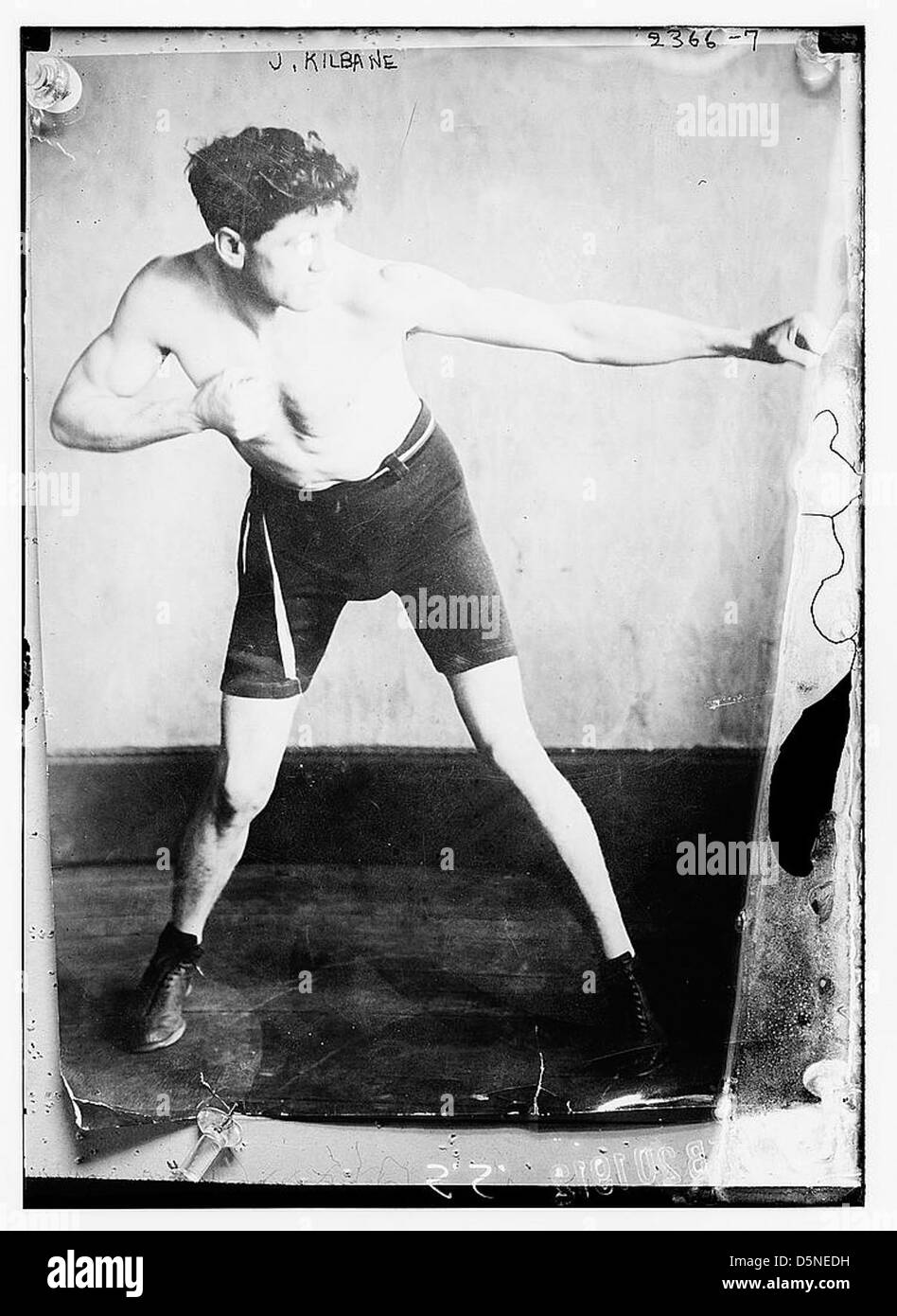 A portrait of J. Kilbane, a professional boxer, captured in the 1910s ...