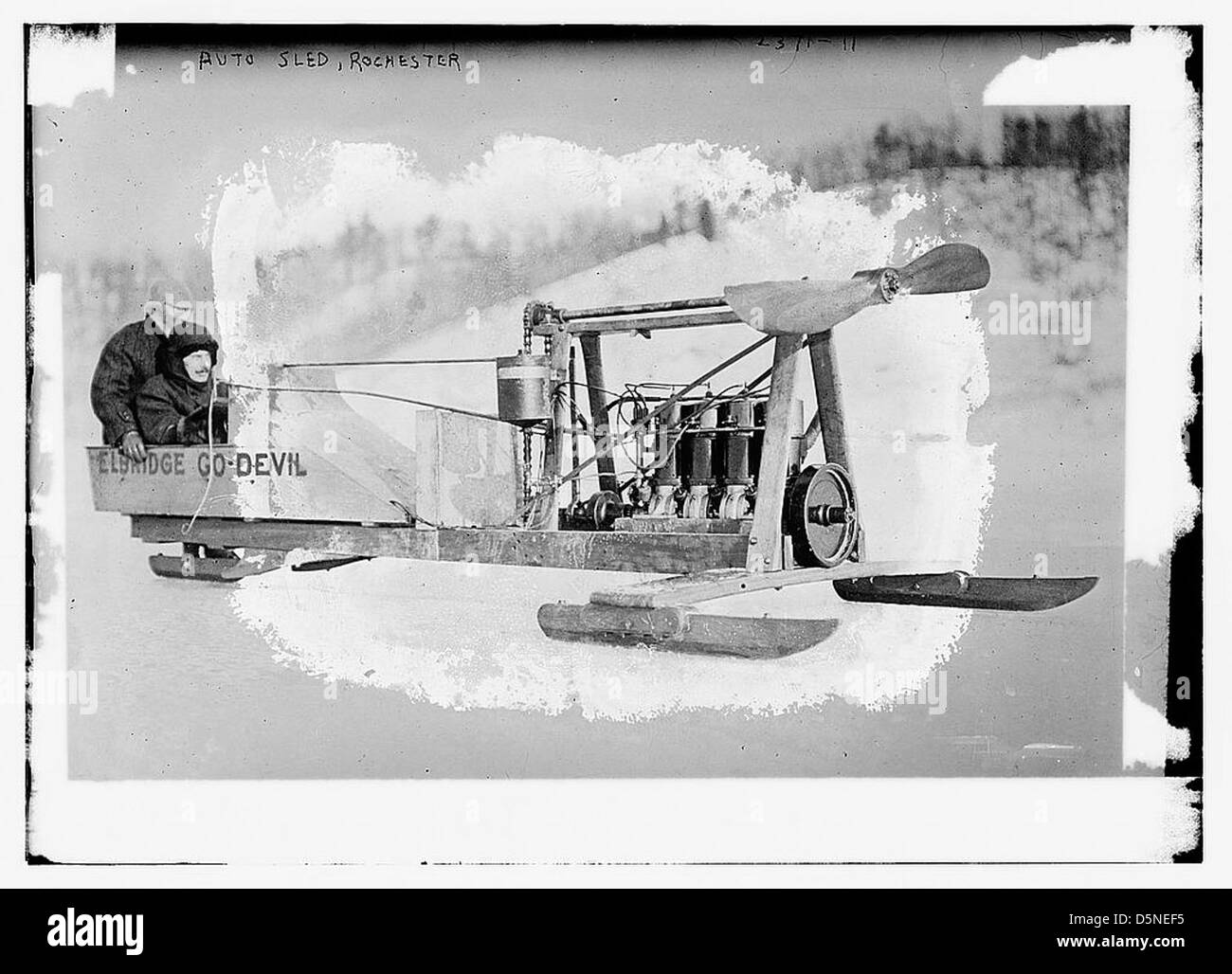 This image shows an auto sled from the 1910s, an early form of snow ...