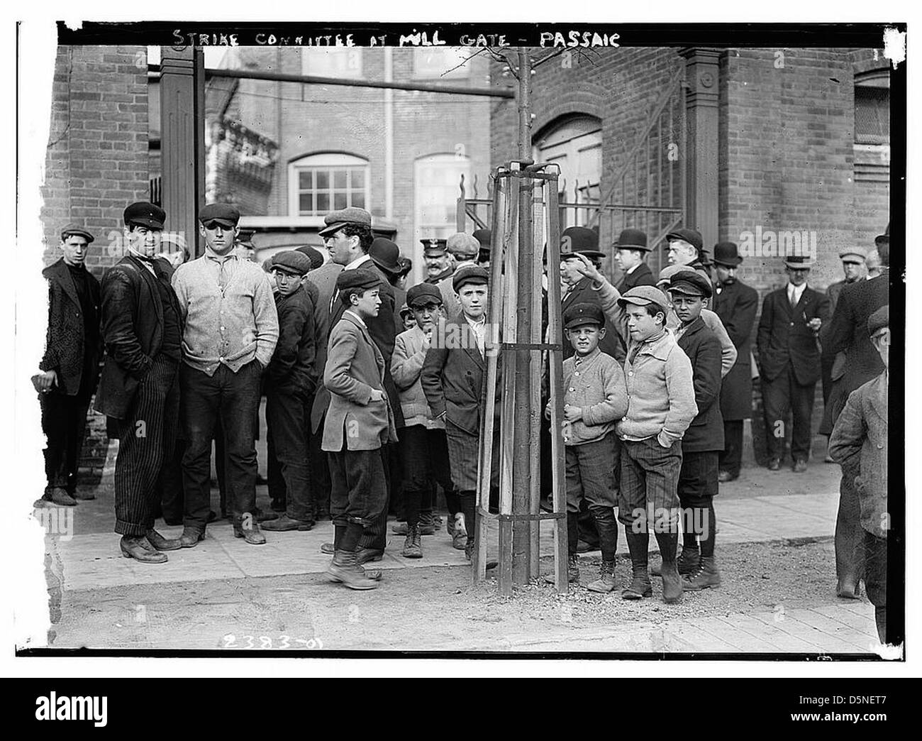 This image shows the Strike Committee at the Mill Gate in Passaic, New ...