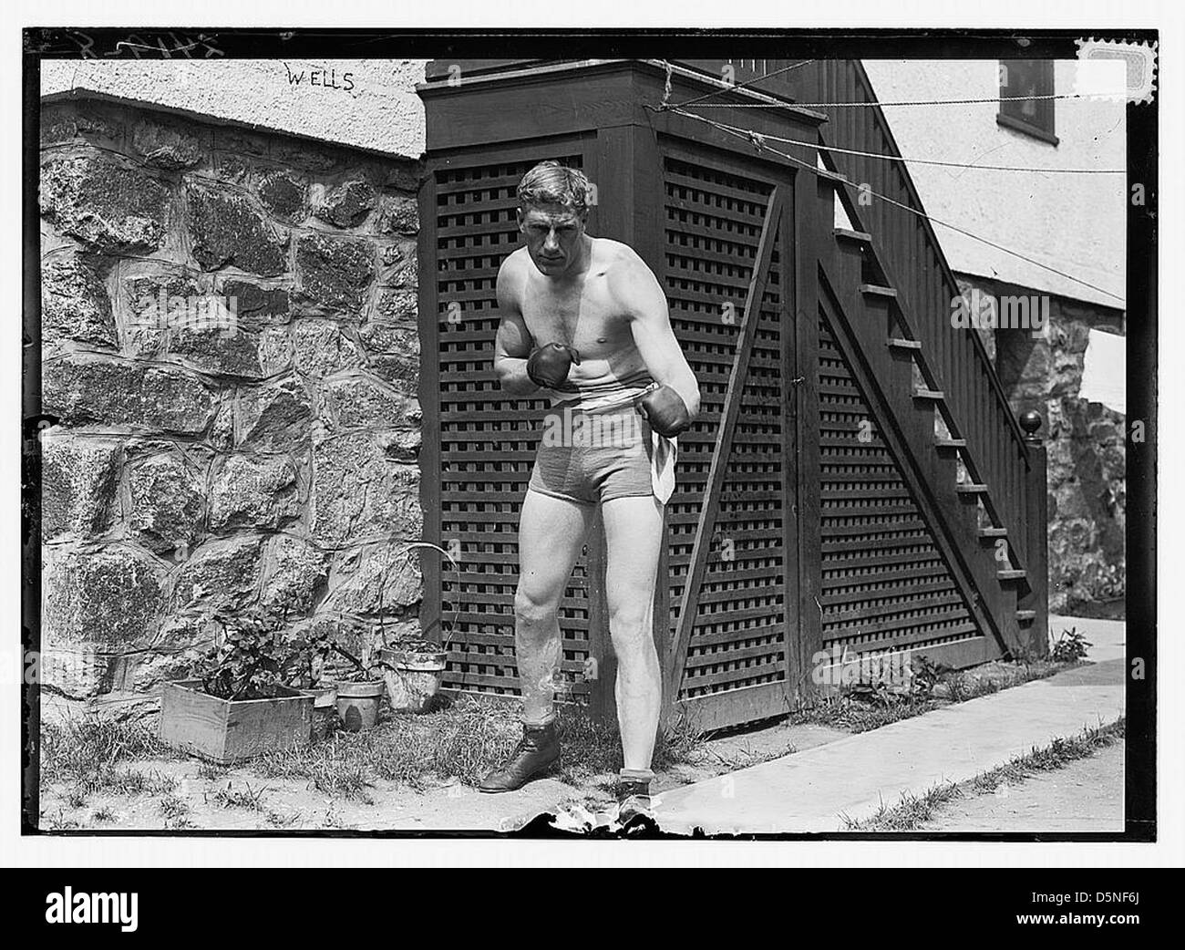 This image shows English boxer Billy Wells preparing for his fight with ...