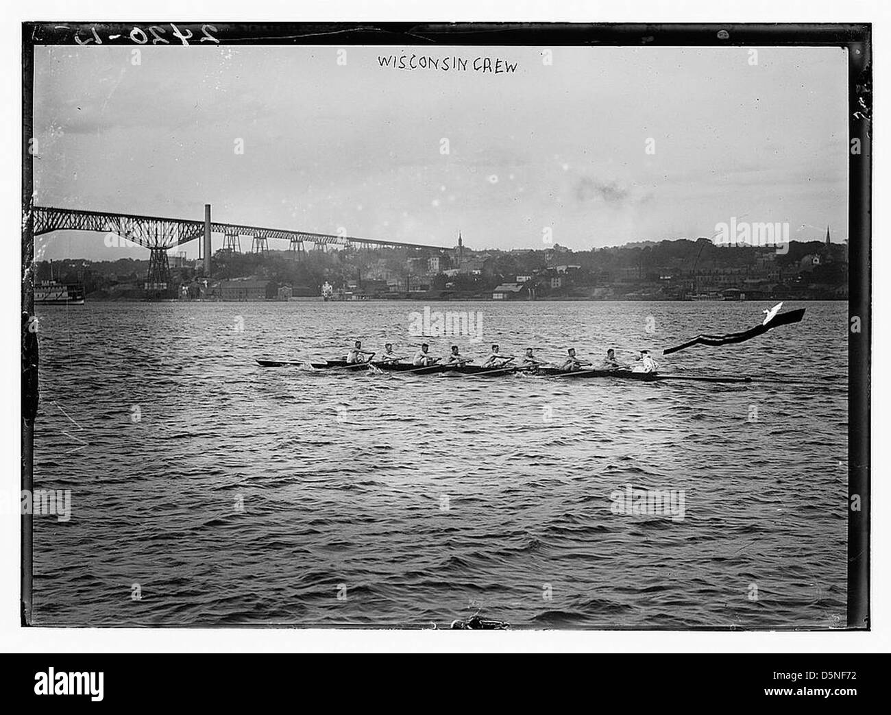 This photograph captures the Wisconsin crew team rowing on the Hudson ...