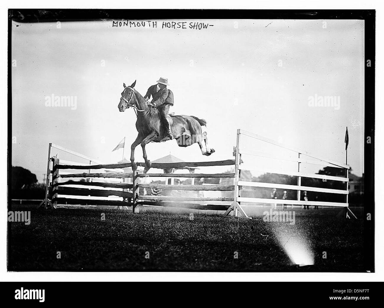 Horse and rider jumping a fence Black and White Stock Photos & Images ...