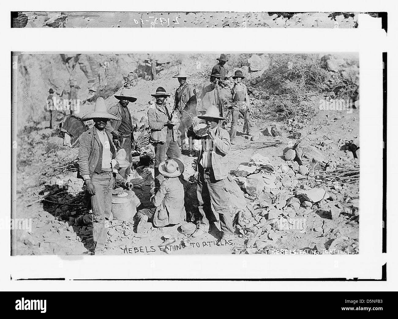 This black-and-white photograph depicts Mexican Revolution rebels ...