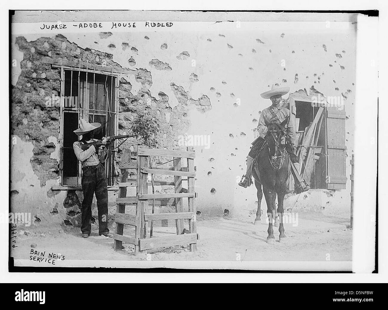 A black-and-white photograph of an adobe house in Juarez, Mexico ...
