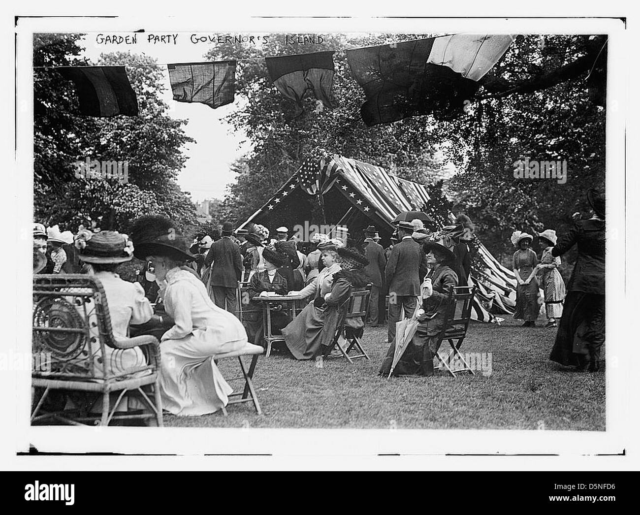 This photograph depicts a garden party on Governor's Island, New York ...