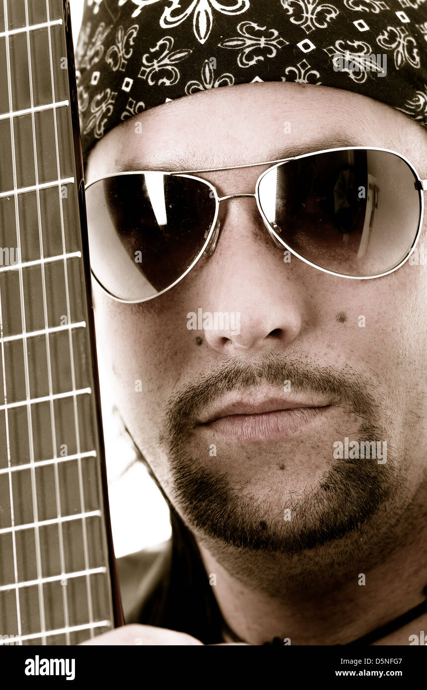 musician and his guitar Face and strings Stock Photo - Alamy