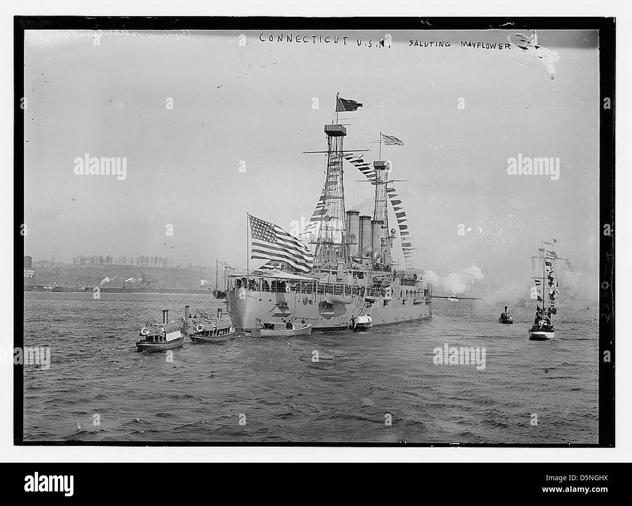 The USS Connecticut (BB-18) salutes the USS Mayflower (PY-1) in this ...