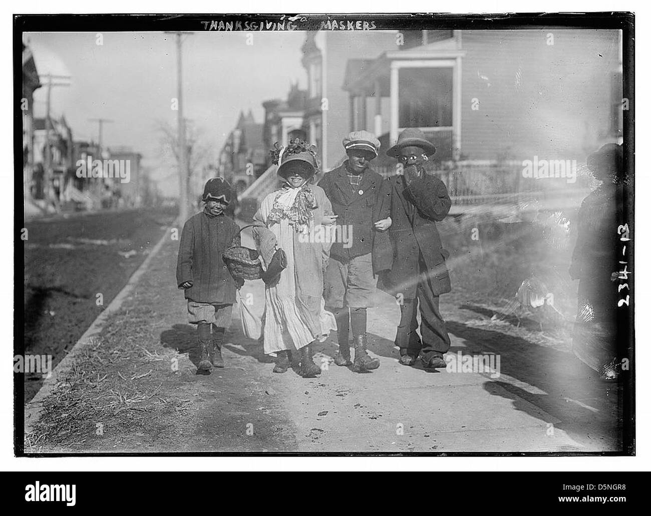 Children dressed in costumes for Thanksgiving, partaking in the ...