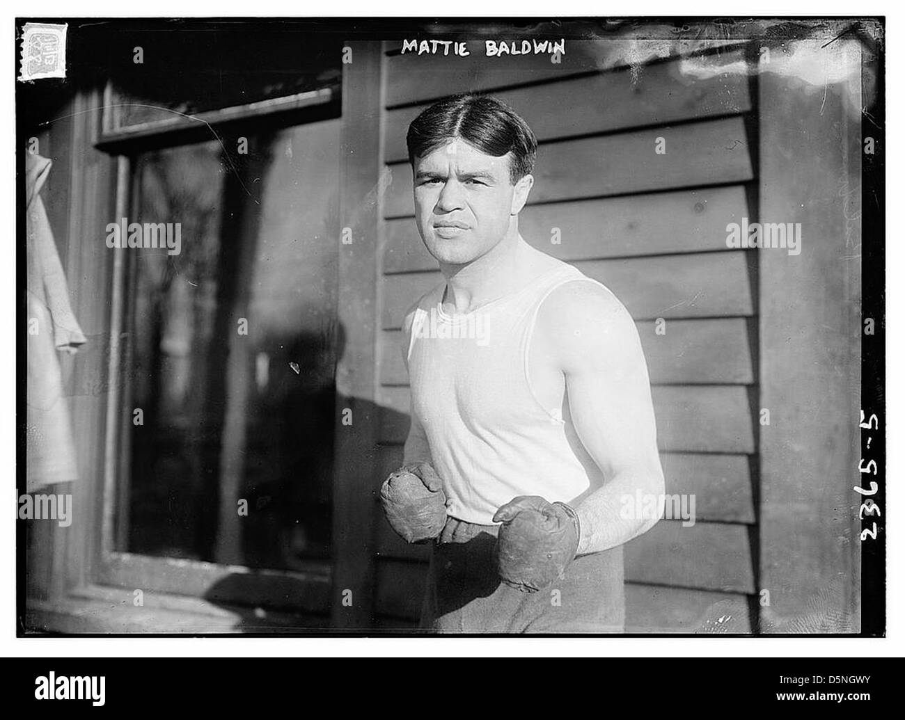 A portrait of Mattie Baldwin, a boxer from the 1910s, depicted in black ...