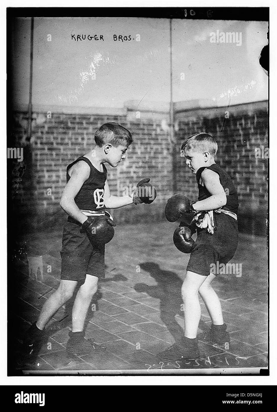 This image shows a boxing match featuring the Kruger Brothers in the ...