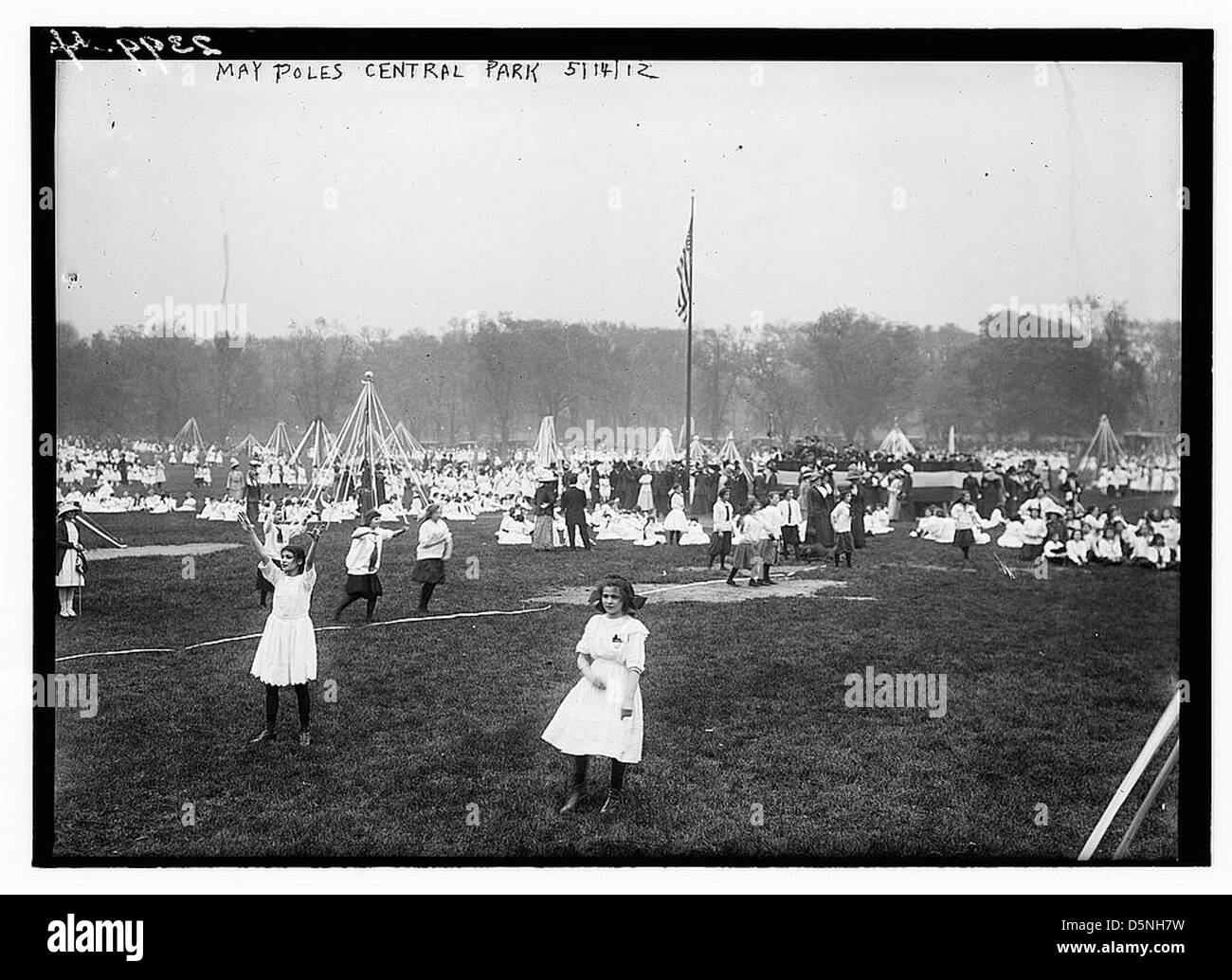 This image shows children dancing around a maypole in Central Park, New ...