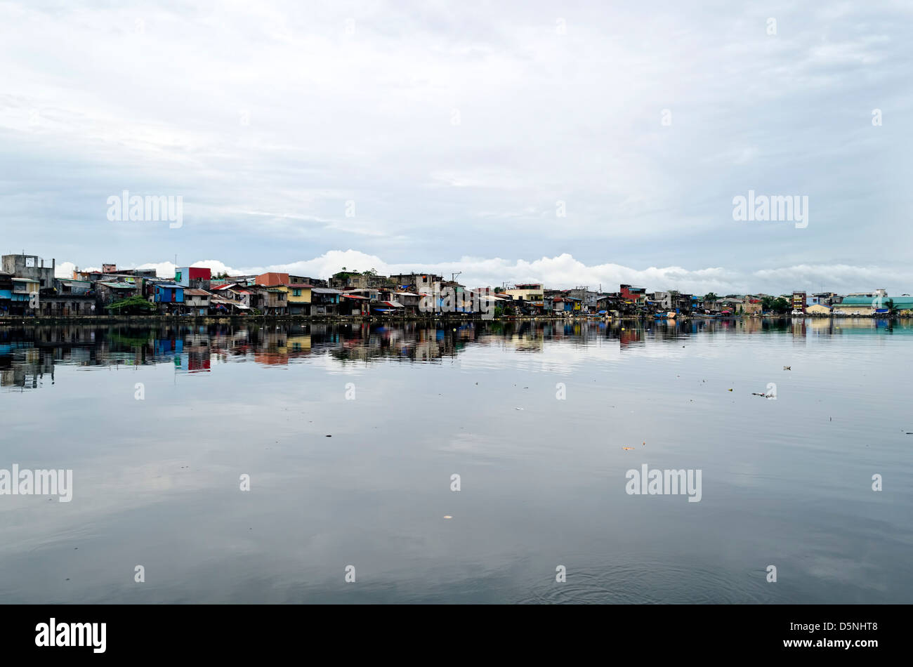 Rows of houses along the Malabon River in Metro Manila, Philippines ...