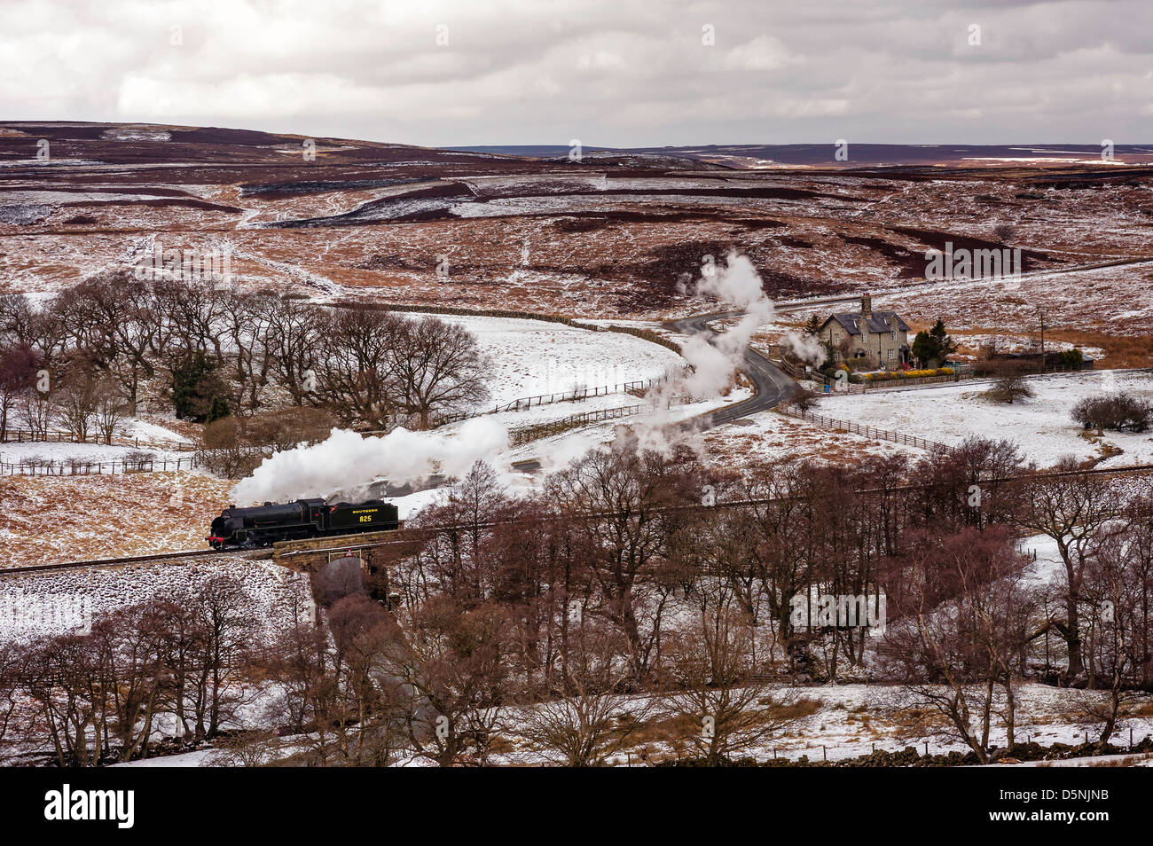 Vintage steam train in the beautiful undulating landscape of the North ...