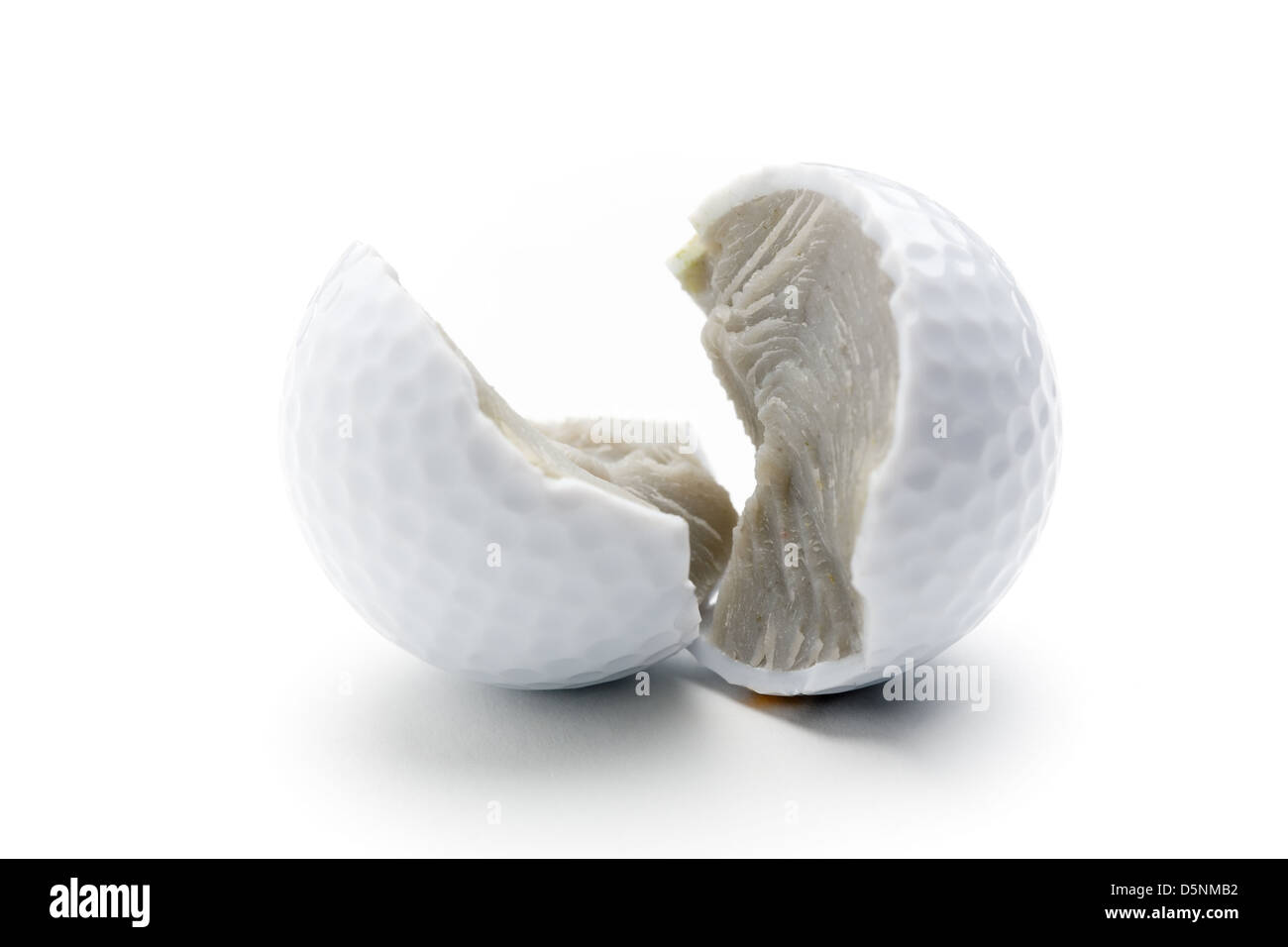 Broken golf ball on white isolated background Stock Photo - Alamy