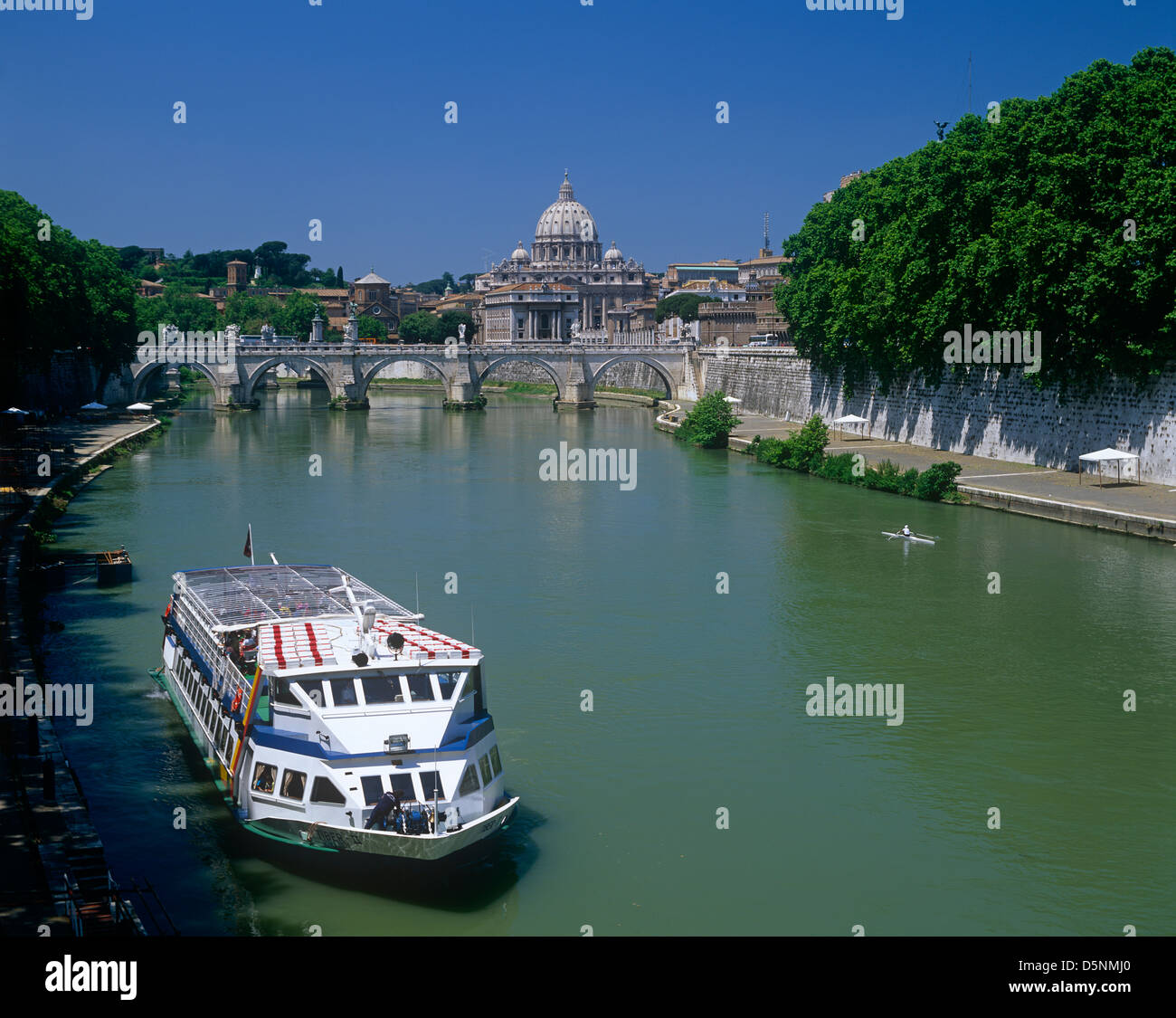 Pleasure boat on the River Tiber with St Peter's Basilica in background ...