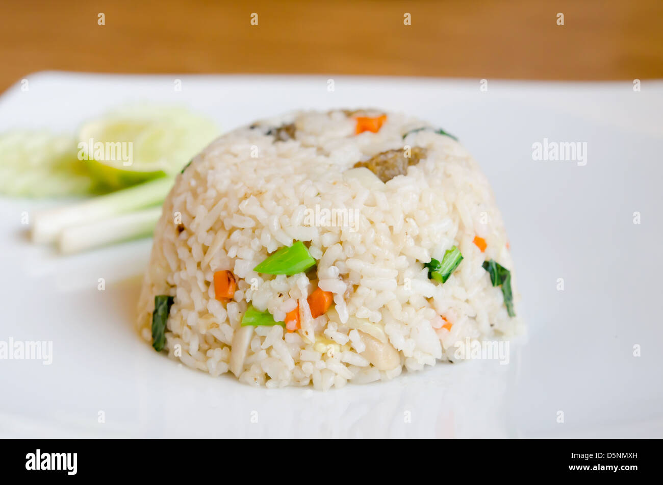 Mixed cooked rice with fried fish and sauce , served with fresh ...
