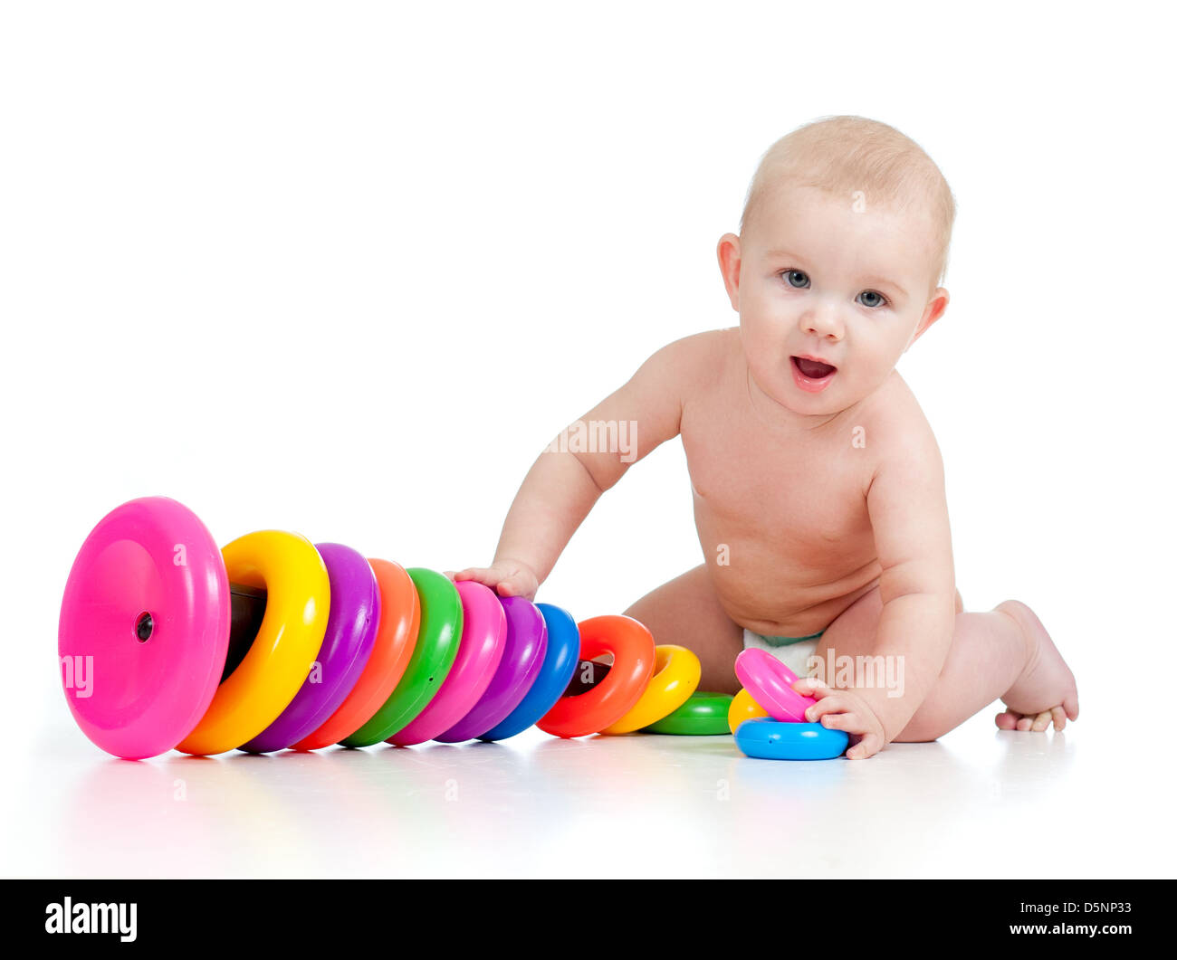 smiling child playing with color toy Stock Photo - Alamy