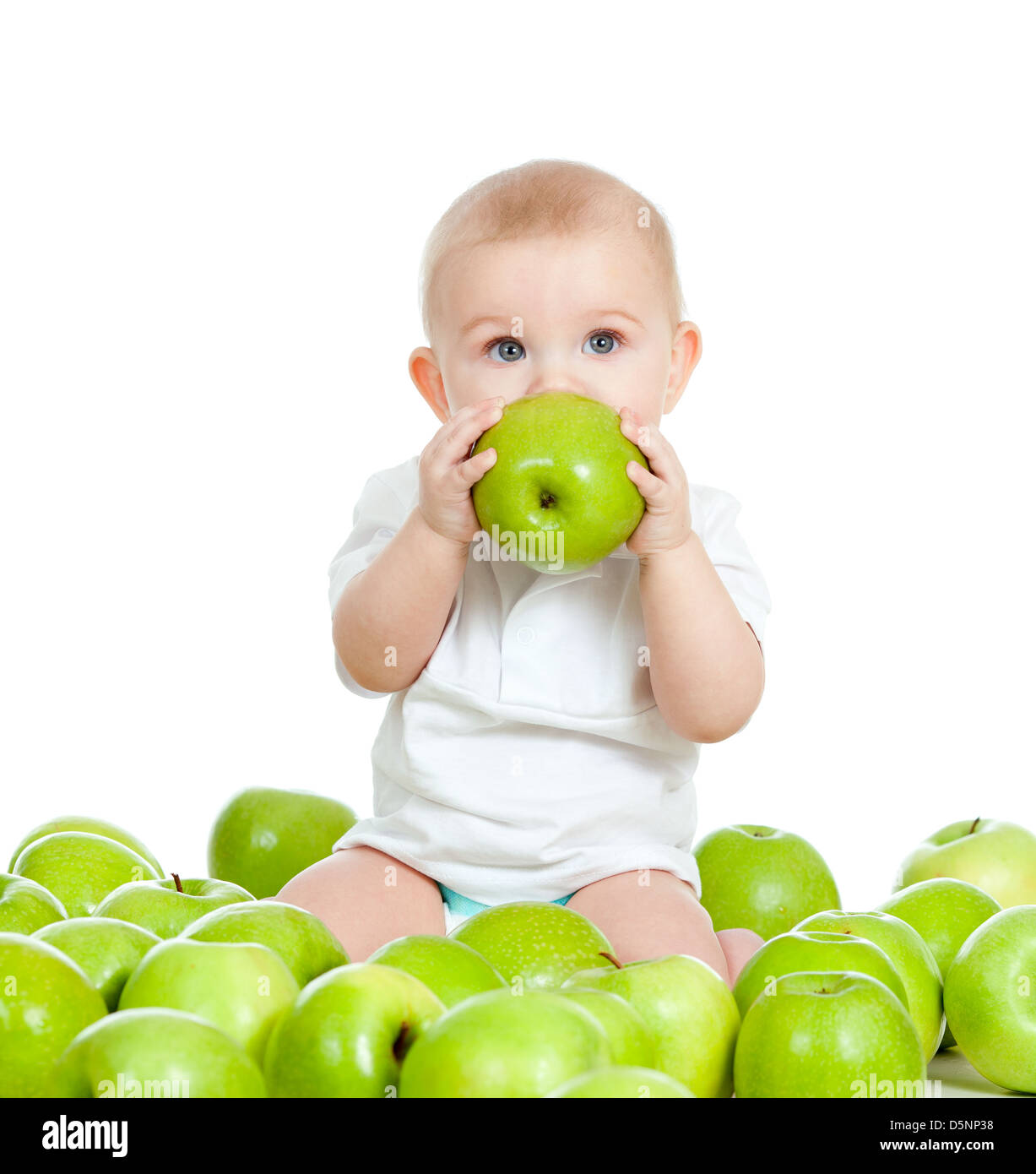 Adorable child with green apples Stock Photo - Alamy