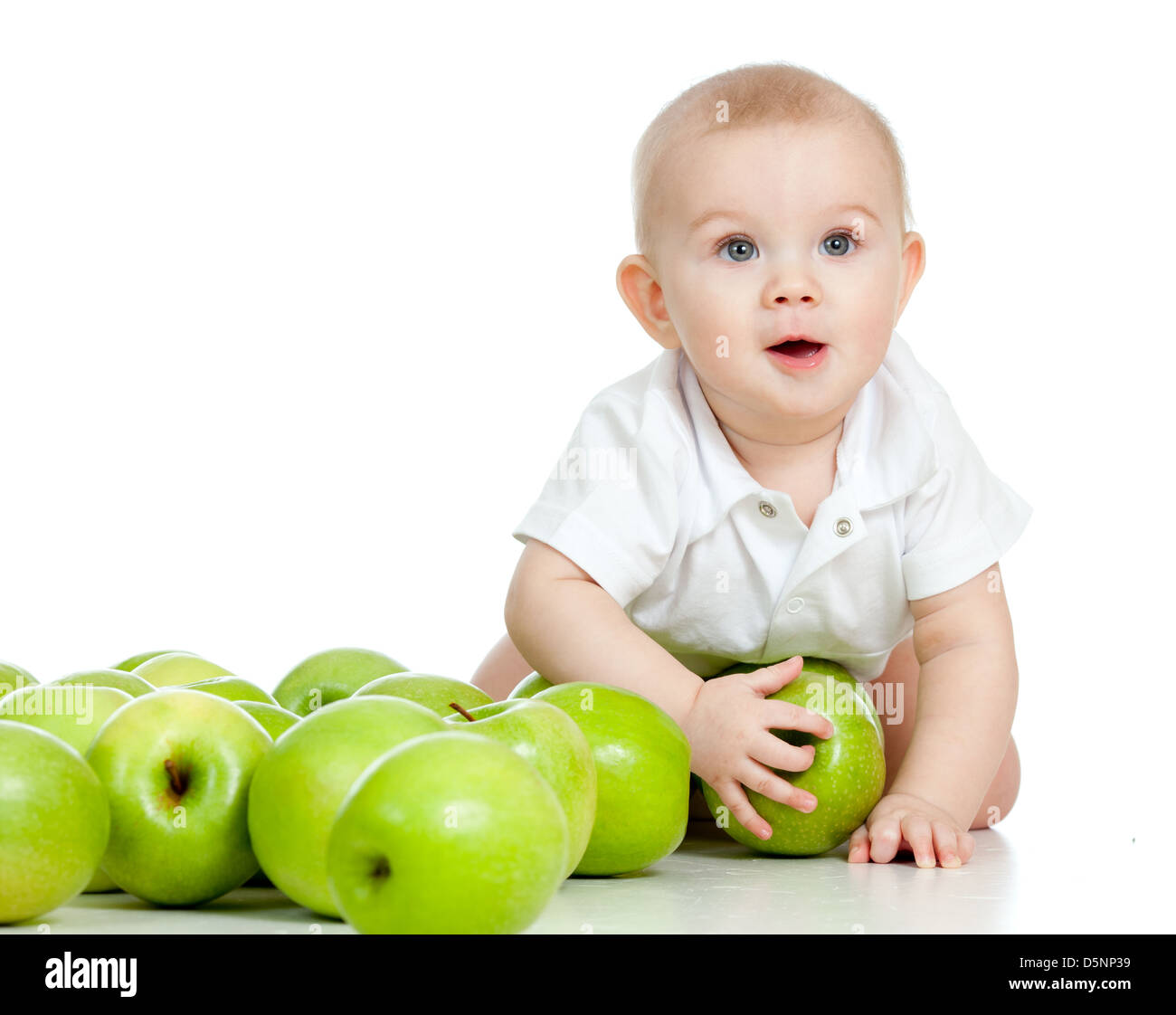 Adorable child with green apples Stock Photo - Alamy