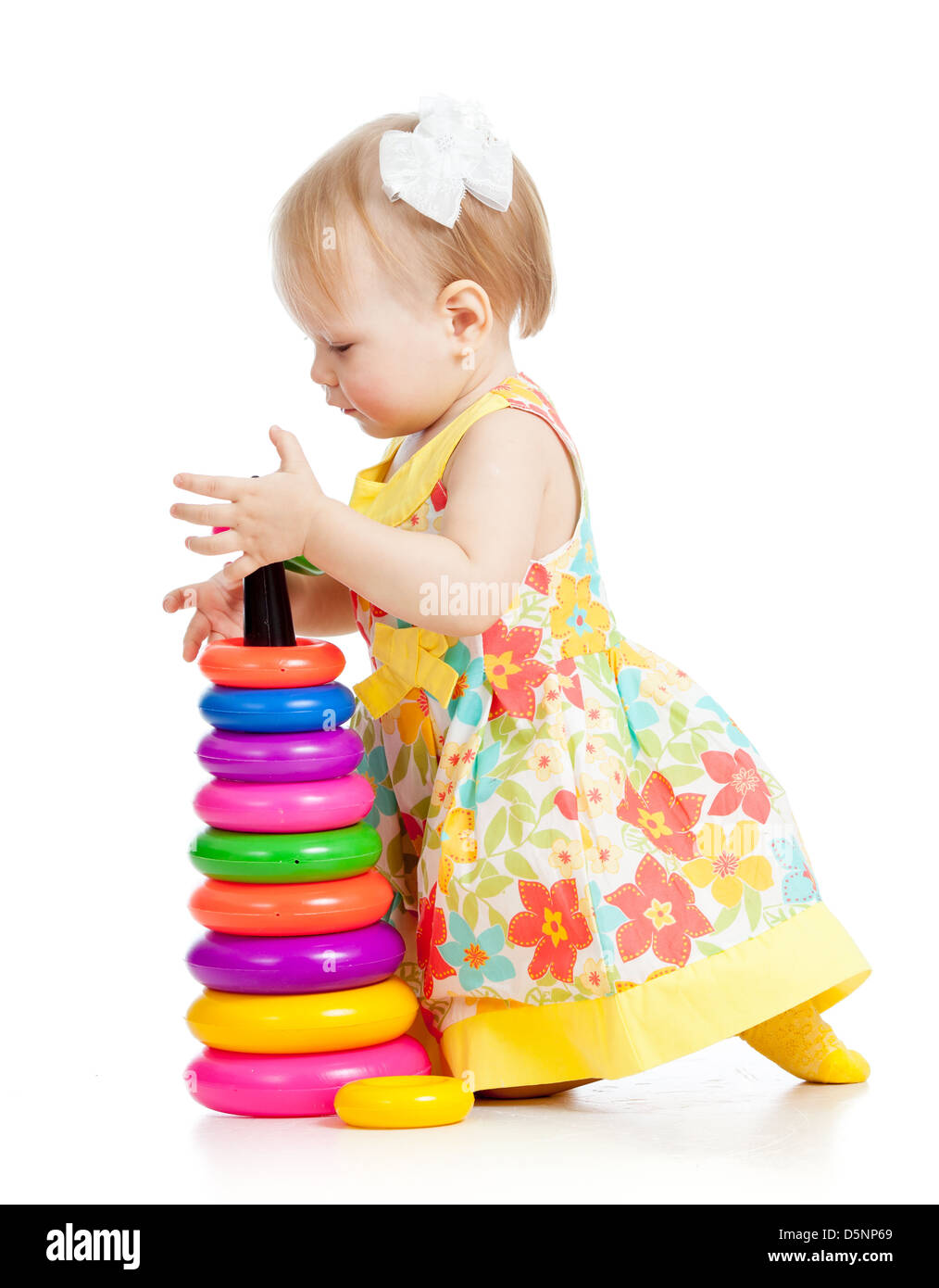 girl building pyramid on floor on white background Stock Photo - Alamy