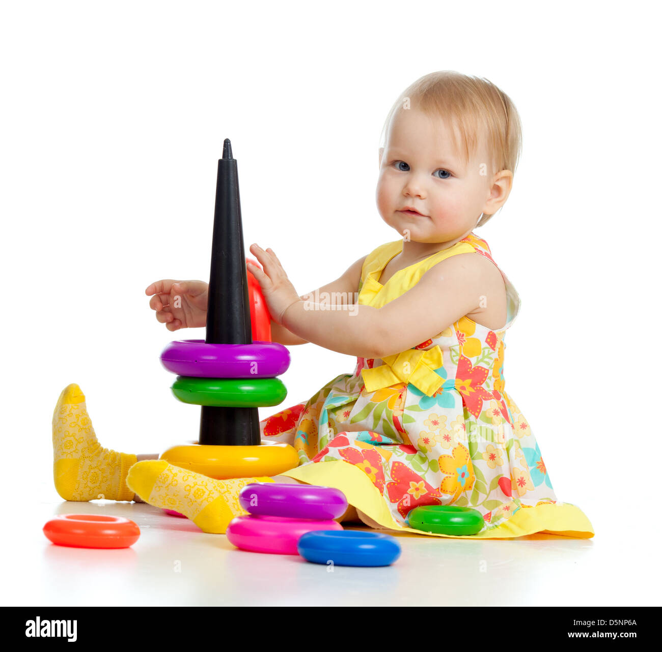 pretty little girl playing with color toy Stock Photo - Alamy