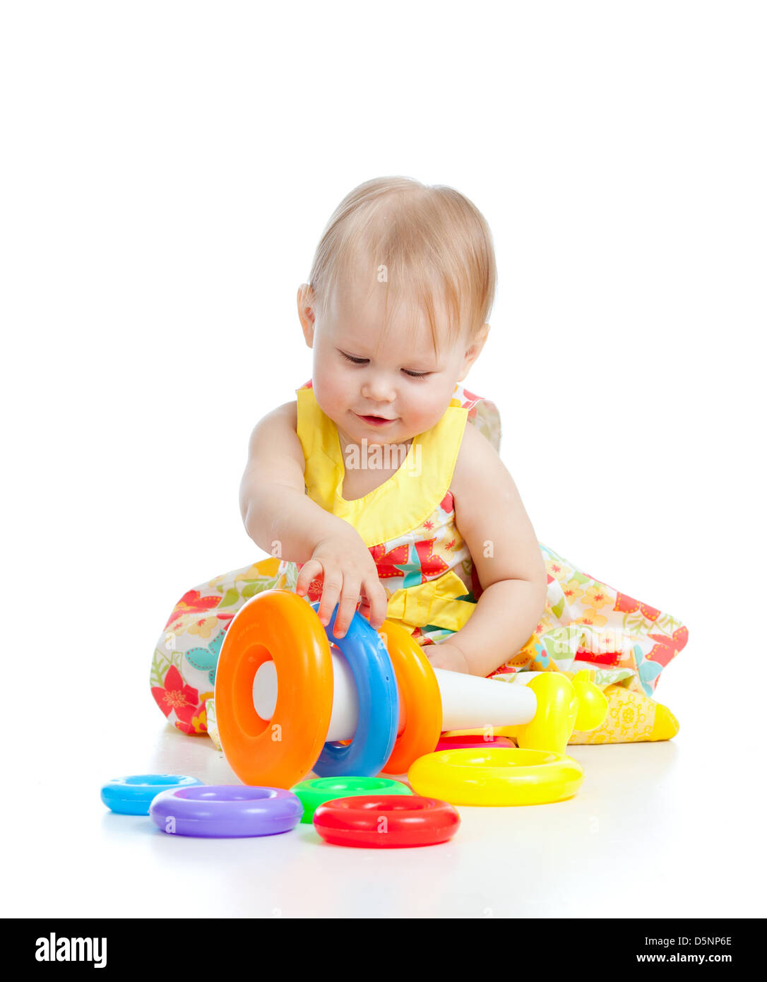 pretty little girl playing with color toy Stock Photo - Alamy