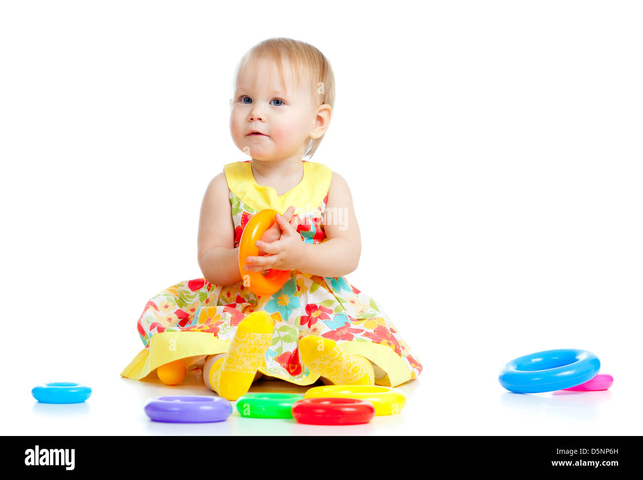 pretty little girl playing with color toy Stock Photo - Alamy