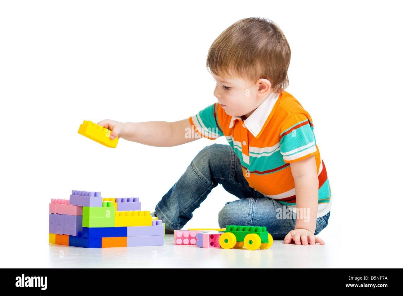 kid boy playing with construction set over white background Stock Photo ...