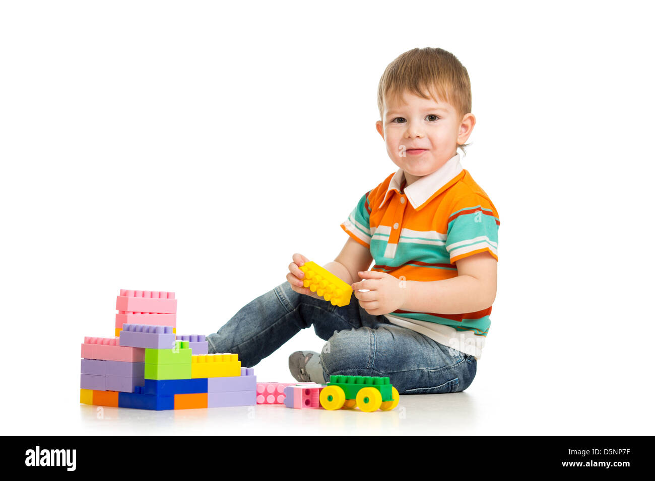 cheerful child boy with construction set over white background Stock ...