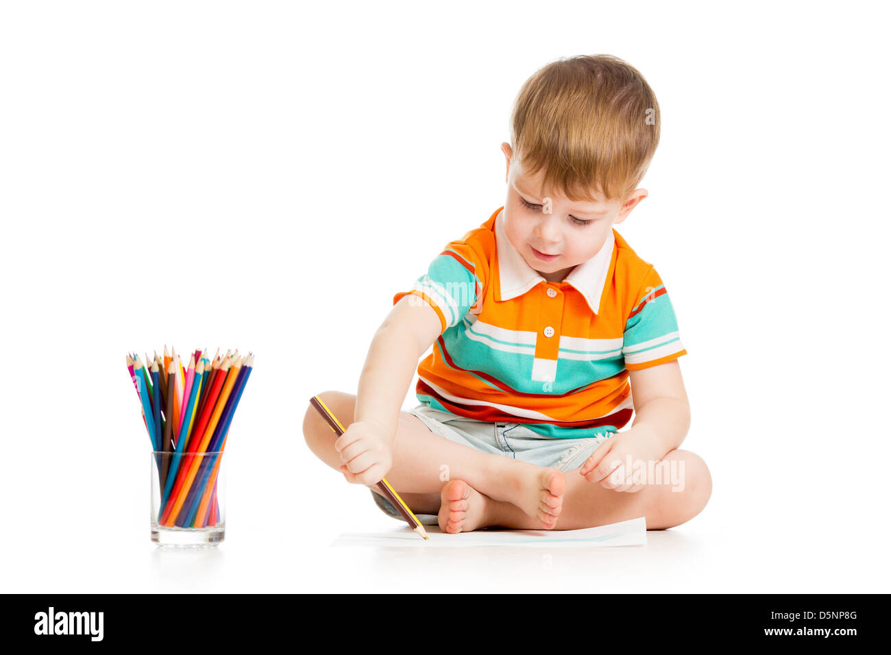 funny baby boy drawing with color pencils Stock Photo - Alamy