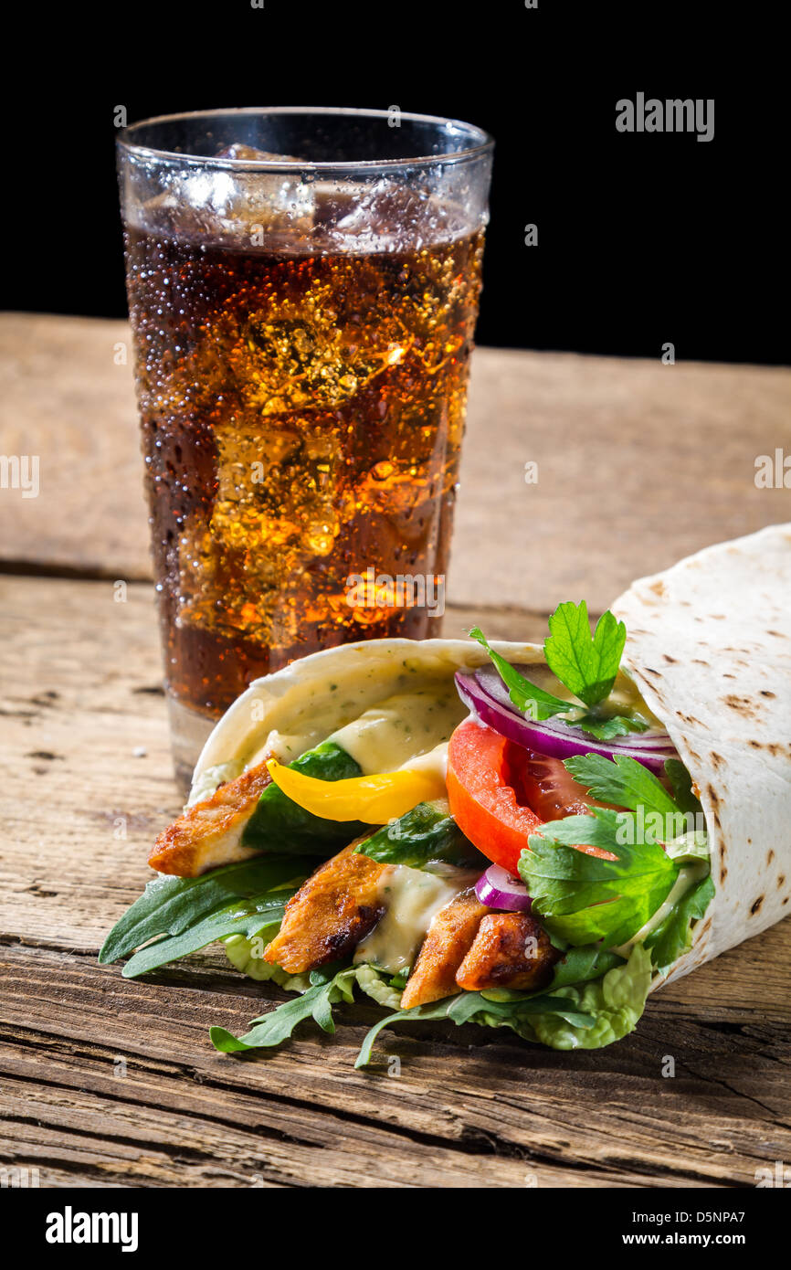 Closeup of kebab with fresh vegetables on black background Stock Photo ...