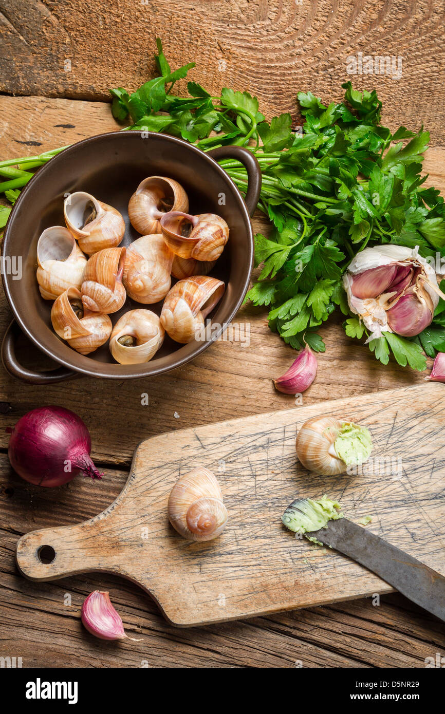 Preparing baked snails Stock Photo - Alamy