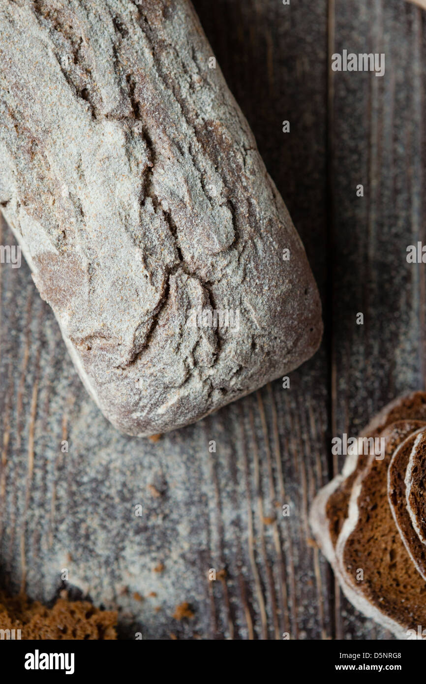 whole wheat bread with cracks on the boards, food Stock Photo - Alamy